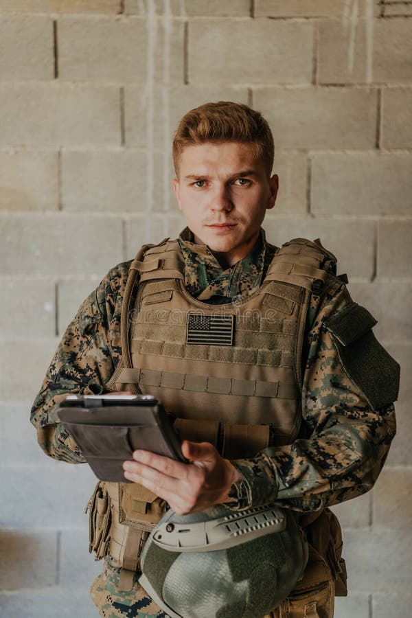 Soldier Using Tablet Computer Against Old Brick Wall Stock Image ...