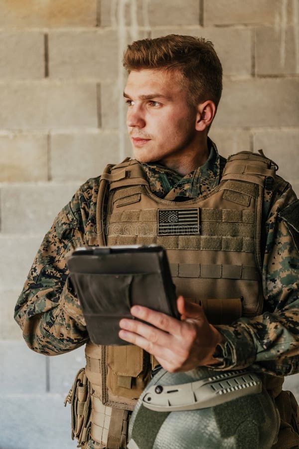 Soldier Using Tablet Computer Against Old Brick Wall Stock Photo ...