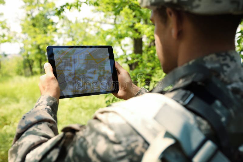 Soldier Using Tablet in Forest. Modern Technology Stock Image - Image ...