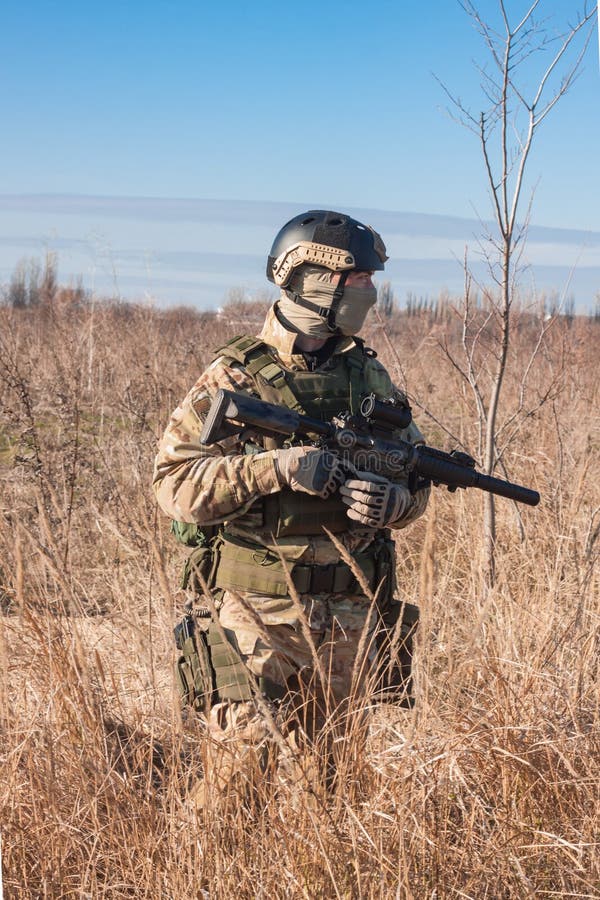 Soldier walking in fields stock photo. Image of security - 82705308