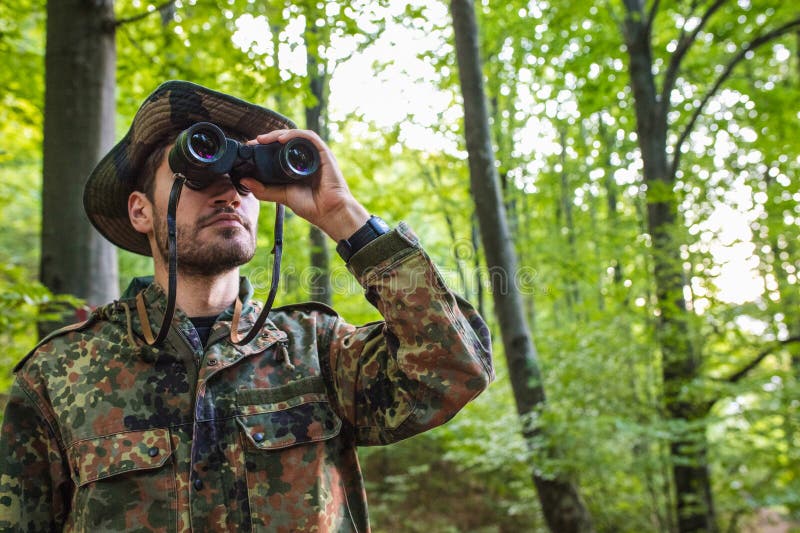 Soldier Wearing Camouflage Uniform Using Binoculars in Forest Stock ...