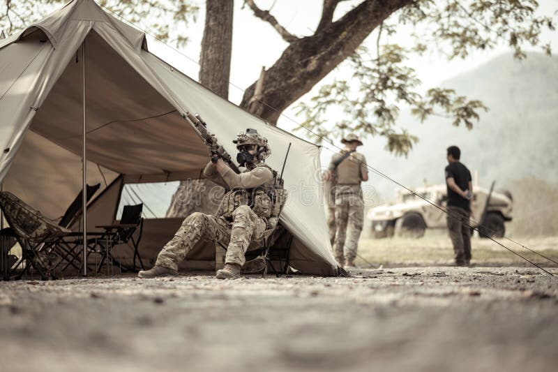 Soldiers in Camouflage Uniforms Planning on Operation in the Camp ...