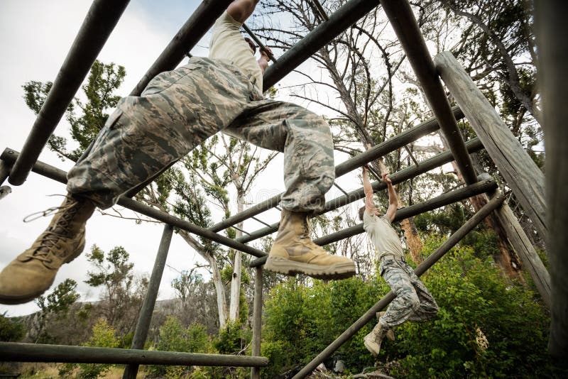 Soldiers Climbing Monkey Bars Stock Photo - Image of confident ...