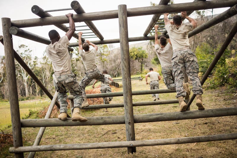 Soldiers Climbing Monkey Bars Stock Image - Image of confident ...