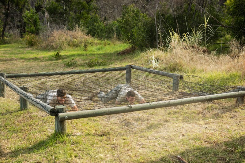 Soldiers Crawling Under Net Obstacle Course Stock Photos - Free ...