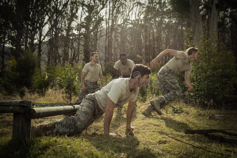 Soldiers Crawling Under the Net during Obstacle Course Stock Image ...