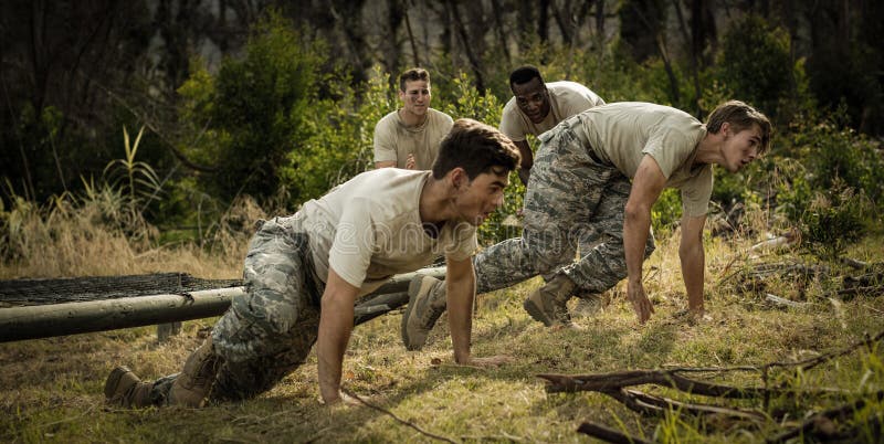 Soldiers Crawling Under the Net during Obstacle Course Stock Photo ...
