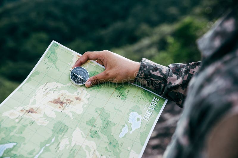 Soldiers Holding Compass and Map for Determines the Location Stock ...