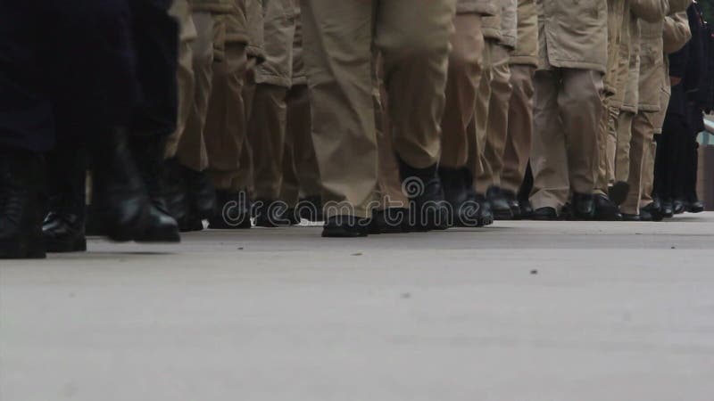 Soldiers Marching Along a Dusty Road at Sunset, Showcasing Teamwork and ...