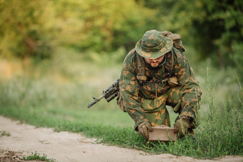 Soldiers Set Mine in the Grass Stock Photo - Image of fight, army: 56536224