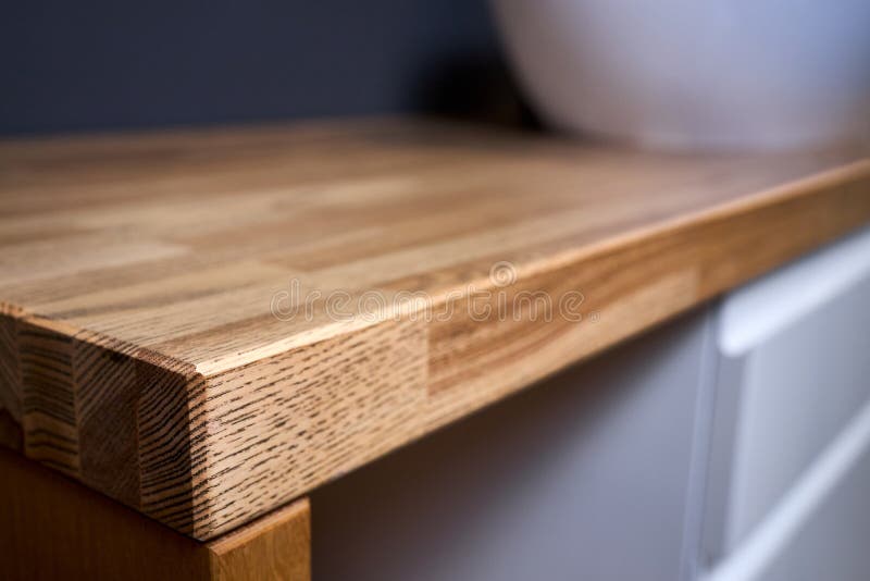Solid Ash Glued Timber Corner Table Top Closeup. Bathroom Interior ...