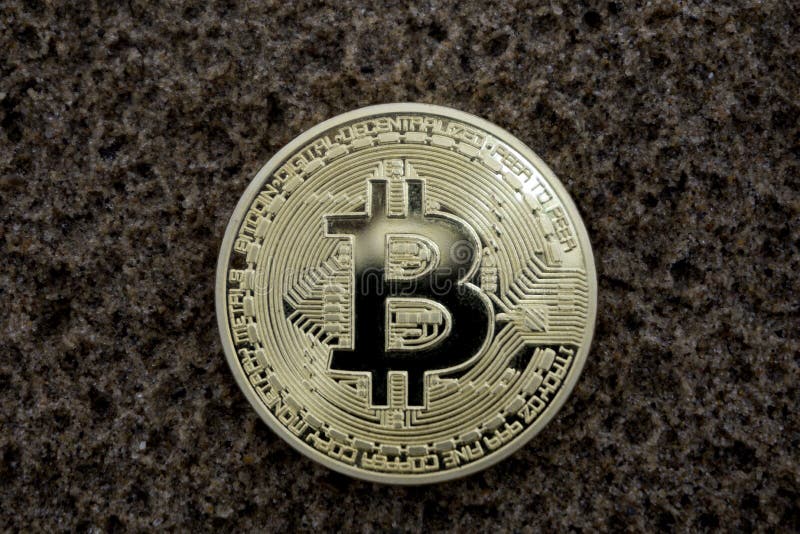 Solid Background with Golden Bitcoin Coin in the Sand Stock Photo ...