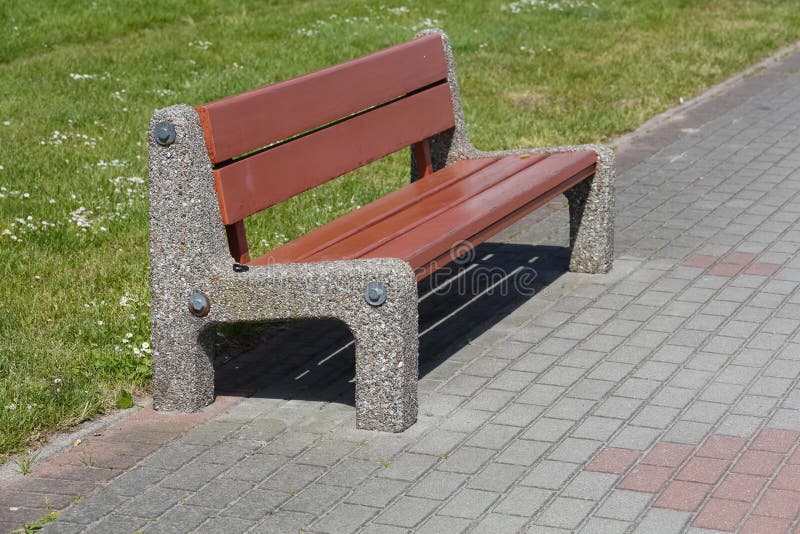 A Solid Bench at the Edge of the Sidewalk Stock Image - Image of ...