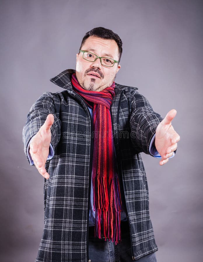Solid Cheerful Man in Coat and Kerchief Standing Welcome Stock Image ...