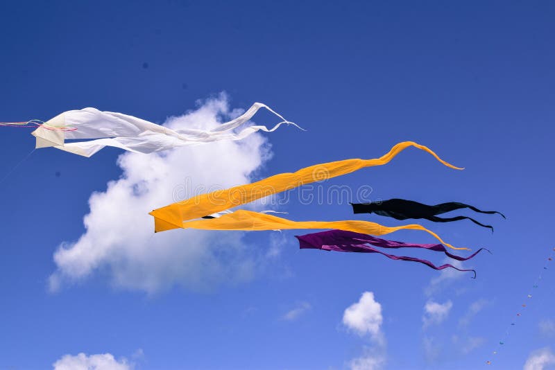 Solid colored kites in sky stock photo. Image of beautiful - 158415326