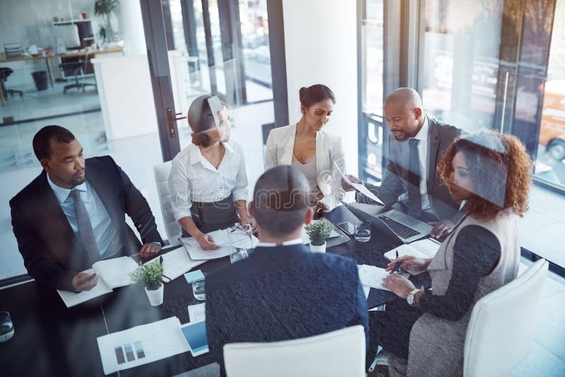 Solid Decisions Made by a Solid Team. a Team of Professionals Having a ...