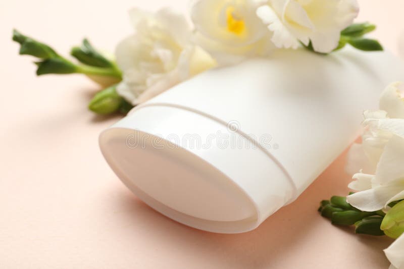 Solid Deodorant and Beautiful Eustoma Flowers on Beige Background ...