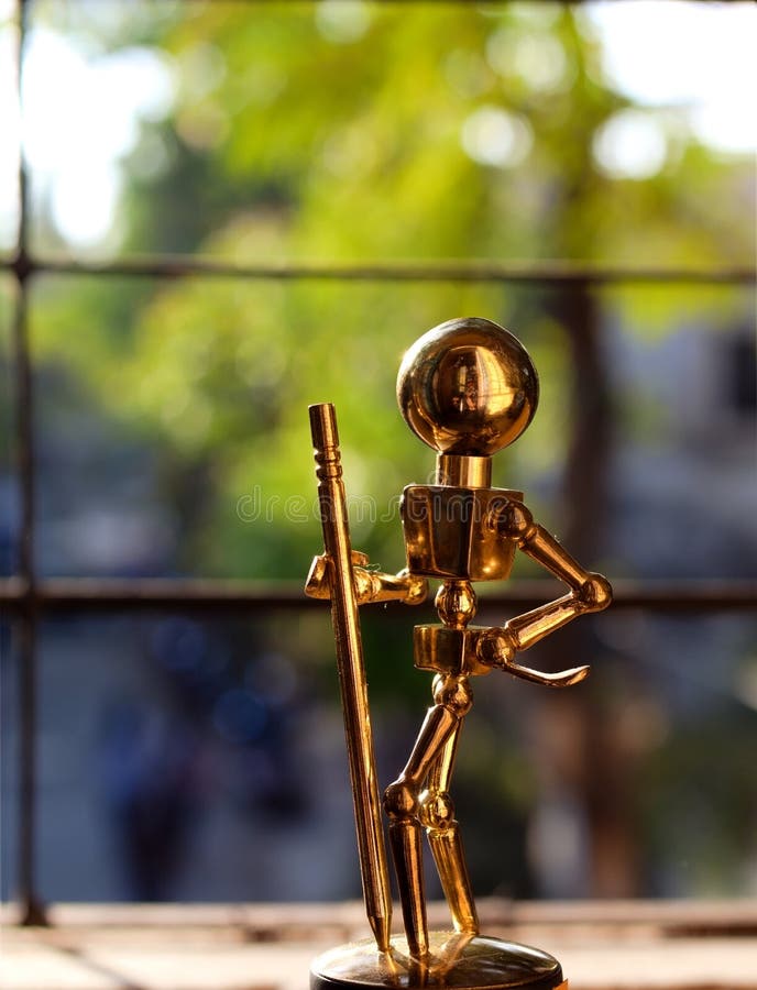 Solid Gold Statue Standing Under Soft Sunlight Editorial Image - Image ...
