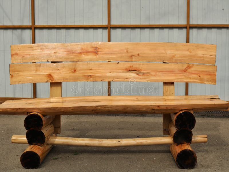 Solid Log Lacquered Bench in a Rustic Yard Stock Image - Image of ...