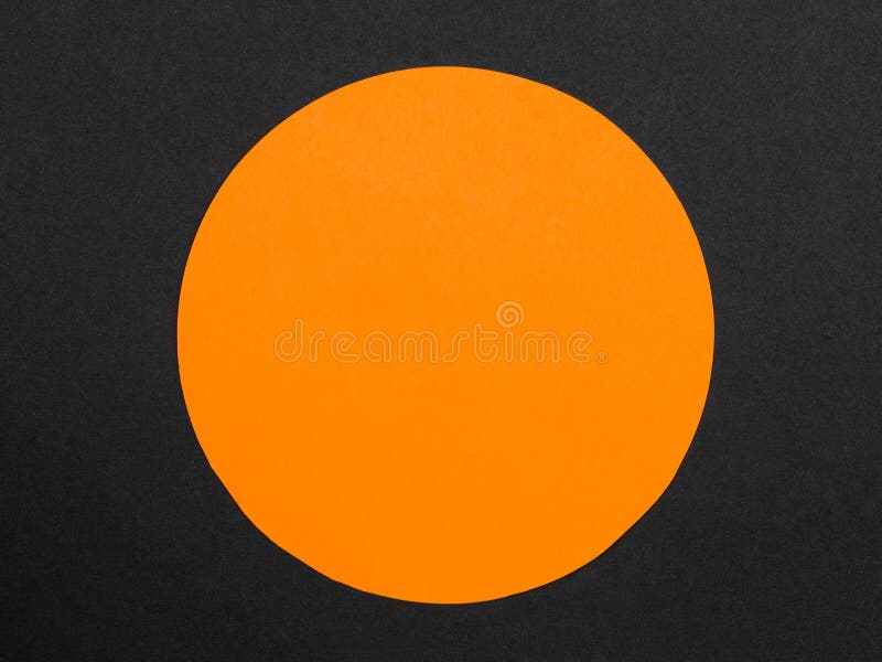 Solid Orange Disc or Circle Against a Black Background Stock Photo ...