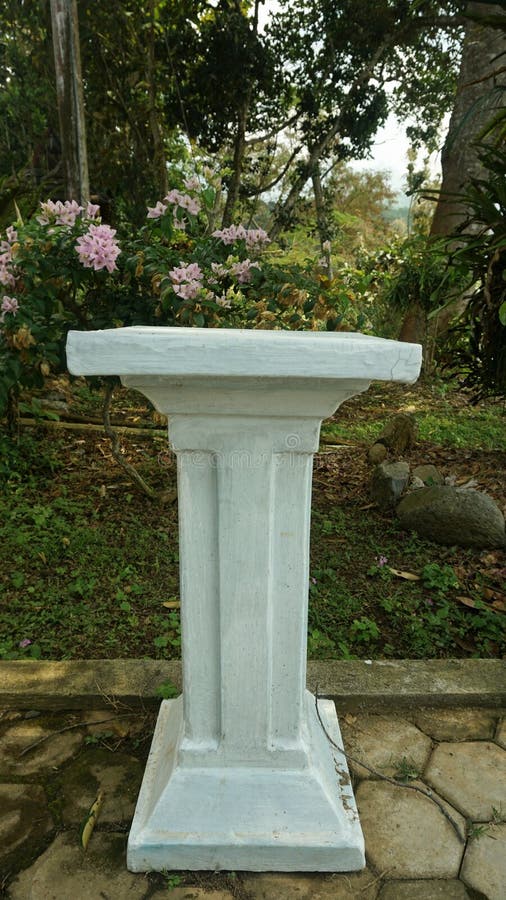 Solid Pedestal Column Base in Garden Setting. Outdoor Decorative ...
