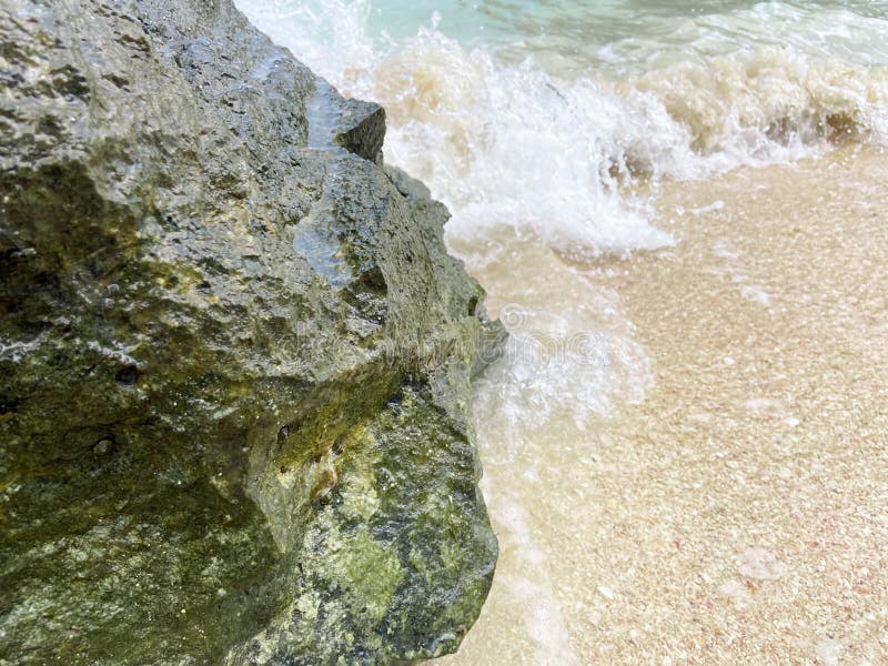 Solid Rock on the Beach stock image. Image of beach - 262982695