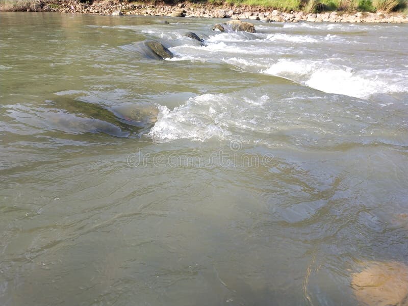Solid Rock Hit by the Flow of Water in a River. Stock Photo - Image of ...