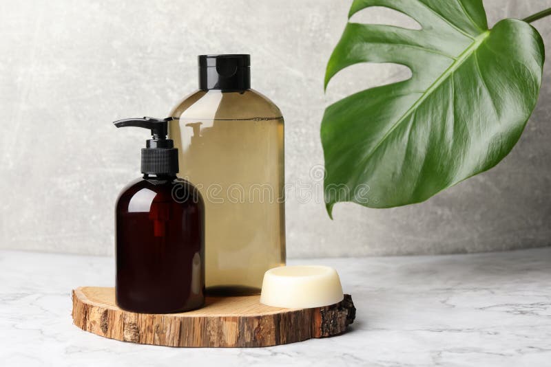 Solid Shampoo Bar and Bottles of Cosmetic Product on White Marble Table ...