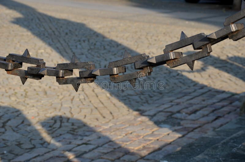 Solid Steel Chain with Rectangular Mesh. There is a Steel Spike on Each ...