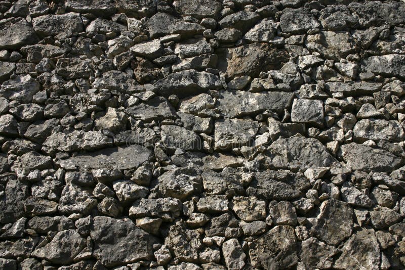 Solid stone wall stock photo. Image of rock, stacked - 13652038