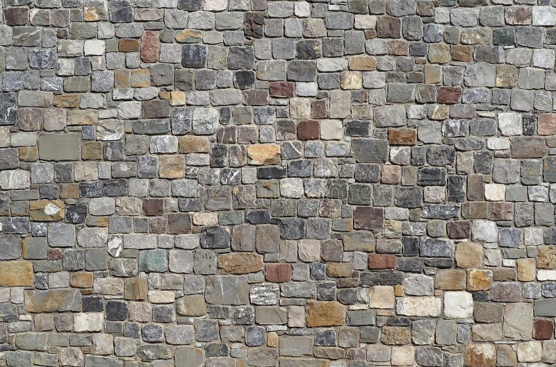 Solid Stone Wall Made of Different Colors Natural Rocks of Square and ...