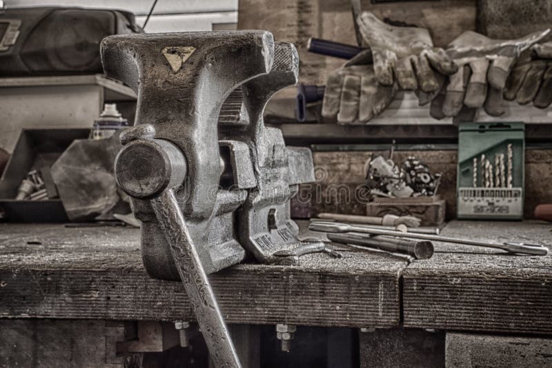 Solid Tabletop Vise on a Messy Workbench. Stock Image - Image of ...