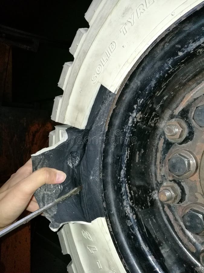 Solid tyre cracking stock photo. Image of worker, crate - 76924566