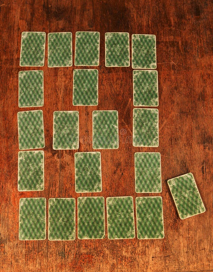 Solitaire of Playing Cards on a Wooden Table Stock Photo - Image of ...