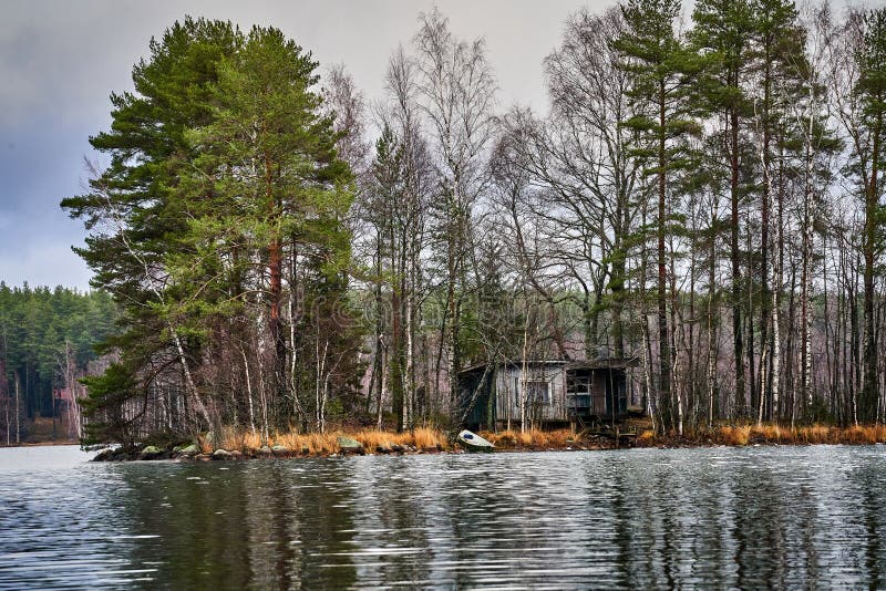 Solitary Hut on the Lakeside Surrounded by Dense Trees Stock Image ...
