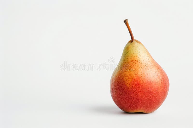 A Solitary Pear Sitting on a White Surface Stock Photo - Image of ...