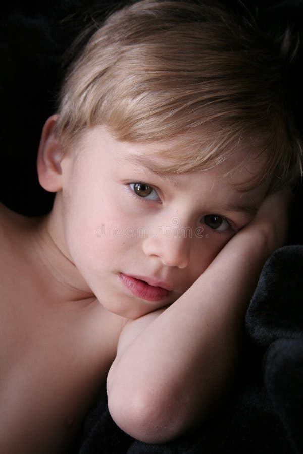 Boy in sand on seashore stock photo. Image of summer, young - 6101838