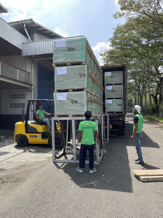 The Process of Loading Goods into Containers. Editorial Photo - Image ...