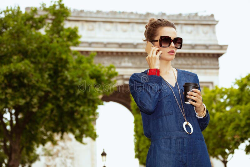 Solo Tourist Woman with Cup of Soy Latte Talking on Mobile Stock Photo ... Solo Tourist Woman with Cup of Soy Latte Talking on Mobile Stock Photo ...