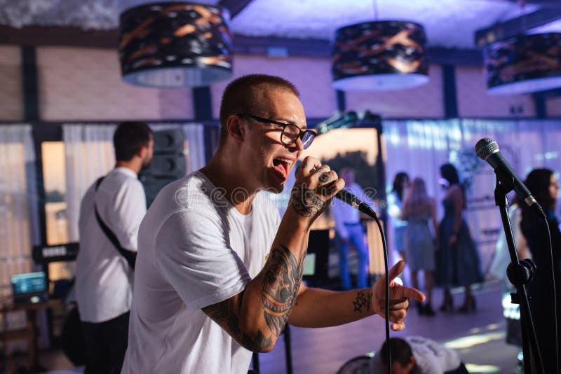 Soloist on Stage at a Concert Singing into a Microphone Editorial Stock ...