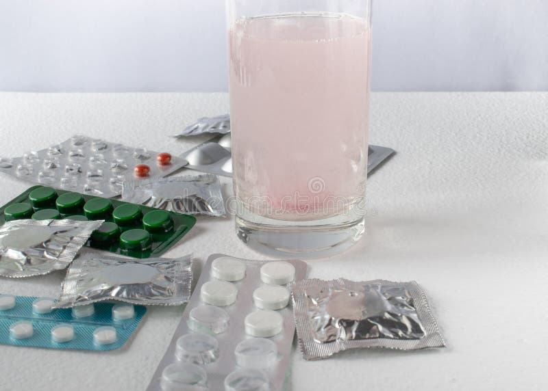 Soluble Tablet In A Glass Of Water. Tablets In Packing On A Light ...