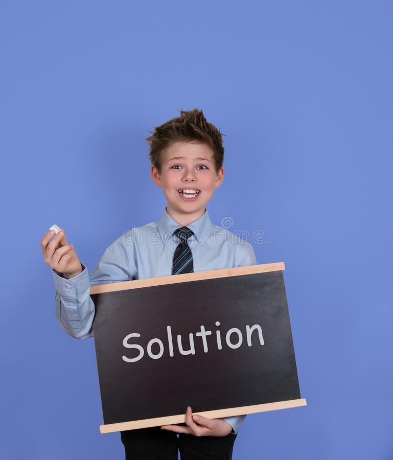 Solution Concept. Boy with Chalkboard Slate on Blue Background Stock ...