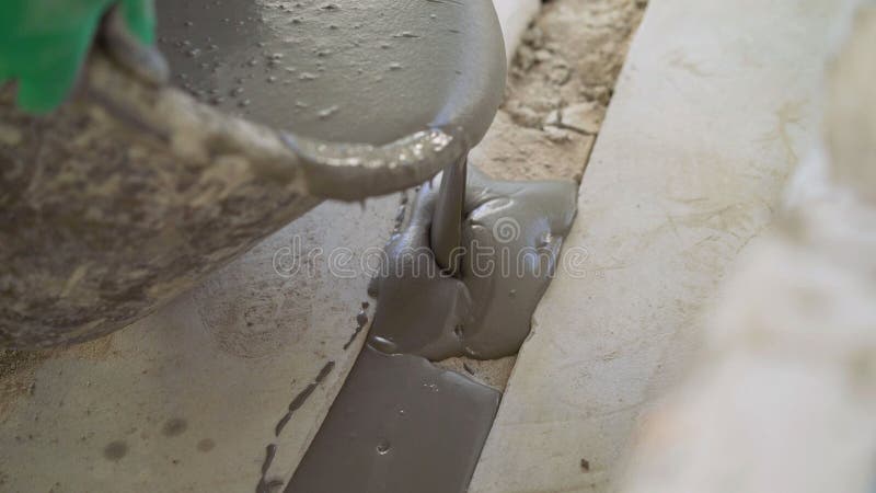Floor Leveling. Filling the Floor with a Self-leveling Compound. Worker ...
