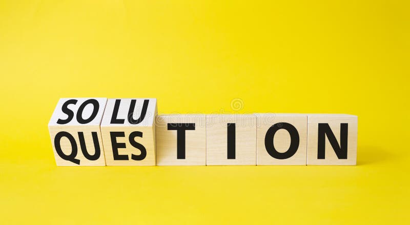 Solution and Question Symbol. Turned Wooden Cubes with Words Question ...