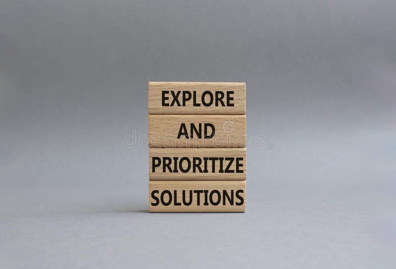 Solution Symbol. Wooden Blocks with Words Explore and Prioritize ...