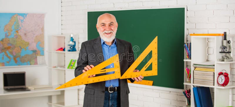 Solve Mathematical Problems. Mature Man Teacher Use Math Triangle Tool ...