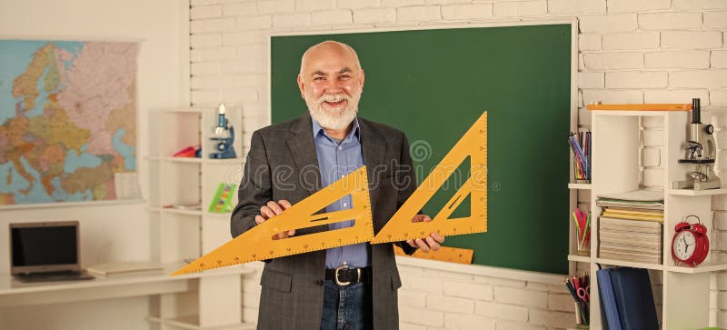 Solve Mathematical Problems. Mature Man Teacher Use Math Triangle Tool ...