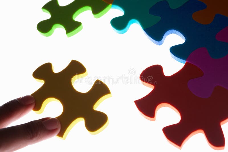 Solving colorful puzzle stock photo. Image of background - 18199764