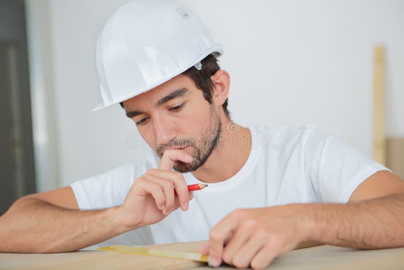 Solving the Measuring Problem Stock Photo - Image of builder, building ...