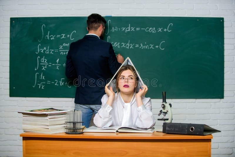 Solving Task. Man Writing on Chalkboard Math Formulas. Teaching in ...